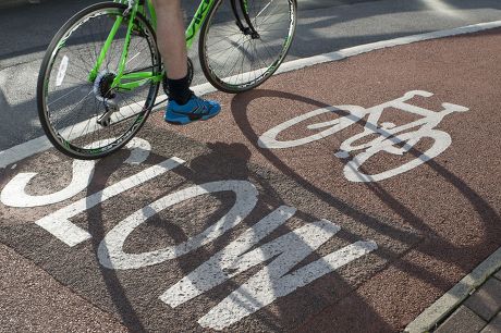 Cyclist On Cycle Lane Displaying Slow Editorial Stock Photo - Stock ...