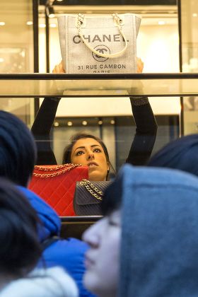 Shop Assistant Puts Chanel Bag On Editorial Stock Photo - Stock Image ...
