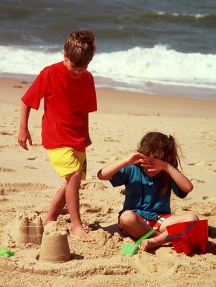 Boy Crushing Sandcastle On Beach Young Editorial Stock Photo - Stock ...