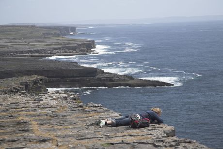 Woman Peering Over Edge Sheer Cliff Editorial Stock Photo - Stock Image ...