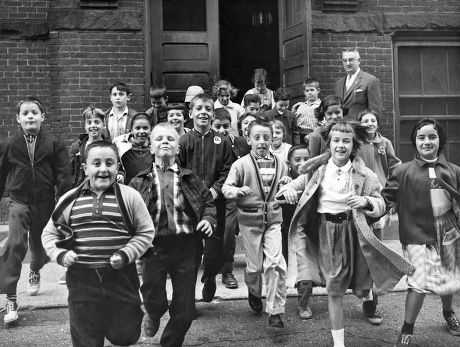 6 Children rushing out of school Stock Pictures, Editorial Images and ...