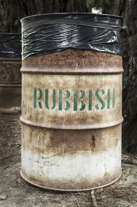 Rusty Tin Rubbish Bin Word Rubbish Editorial Stock Photo - Stock Image ...