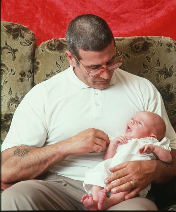 Model Released Man Cradling Baby Editorial Stock Photo - Stock Image ...