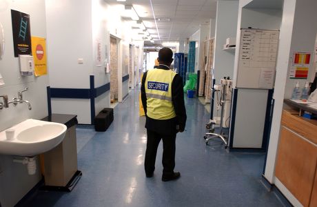 Security Guard Wearing Yellow Jacket On Editorial Stock Photo - Stock ...