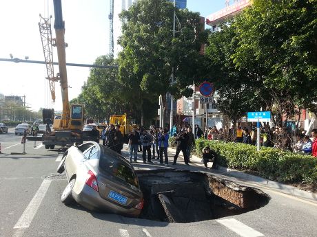 Car Dangles Over Edge Hole Editorial Stock Photo - Stock Image ...