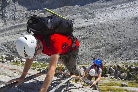 Climbers Descend Ladders Leading Down Onto Editorial Stock Photo ...