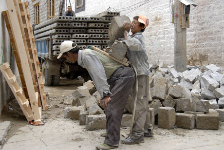 30 Men carrying stones Stock Pictures, Editorial Images and Stock ...