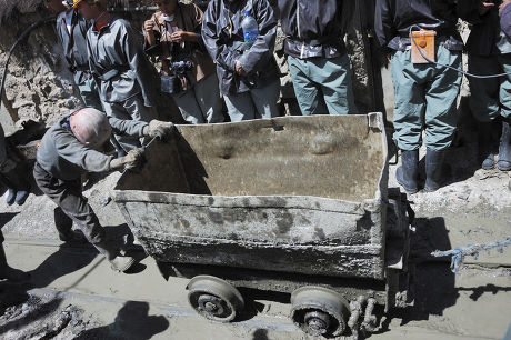 Miner Pushing Empty Cart Out Mine Editorial Stock Photo - Stock Image ...