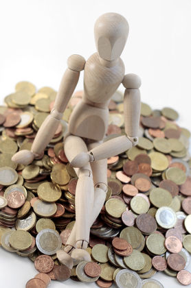 Wooden Doll On Coins Symbolic Image Editorial Stock Photo - Stock Image ...