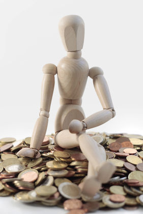 Wooden Doll On Coins Symbolic Image Editorial Stock Photo - Stock Image ...