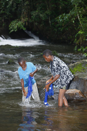 7 Natives washing clothes in a river Stock Pictures, Editorial Images ...