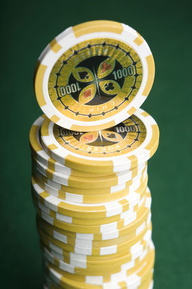 Yellow Poker Chips Stacked On Green Editorial Stock Photo - Stock Image ...
