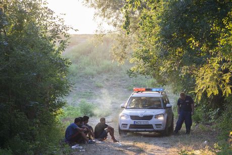 Migrant Helping His Friend Crossing Water Editorial Stock Photo - Stock ...