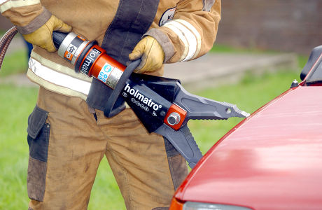 Fire Fighters Using Car Cutting Equipment Editorial Stock Photo - Stock ...