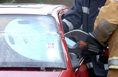 Fire Fighters Using Car Cutting Equipment Editorial Stock Photo - Stock ...