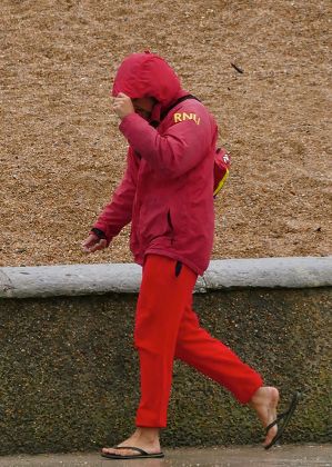 Rnli Lifeguard Walks Along Beach Heavy Editorial Stock Photo - Stock ...
