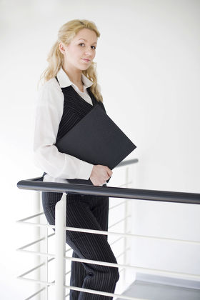 Model Released Businesswoman Leaning Against Railing Editorial Stock ...