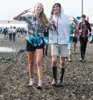 Festival Goers Walk Through Muddy Conditions Editorial Stock Photo ...