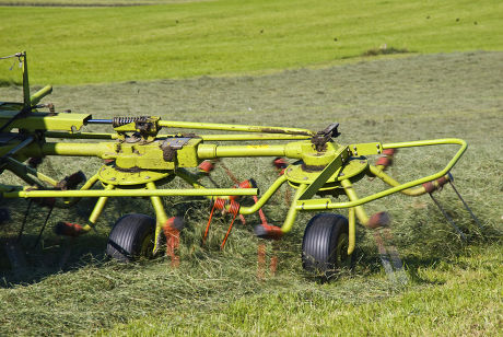Tractor Making Hay On Meadows Editorial Stock Photo - Stock Image ...