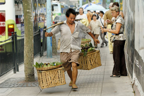 41 Man carry baskets Stock Pictures, Editorial Images and Stock Photos ...