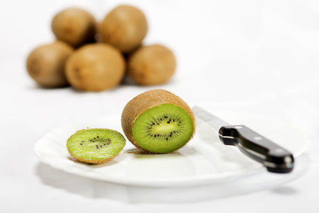 Single Kiwi Cut Open On Plate Editorial Stock Photo - Stock Image ...
