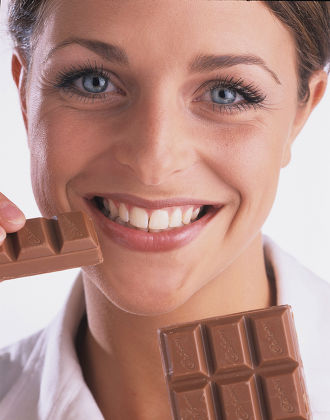 Model Released Young Woman Eating Chocolate Editorial Stock Photo ...