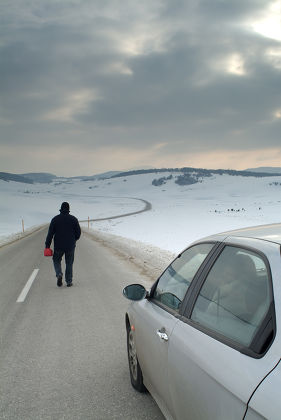 Man Leaves His On Isolated Road Editorial Stock Photo - Stock Image ...