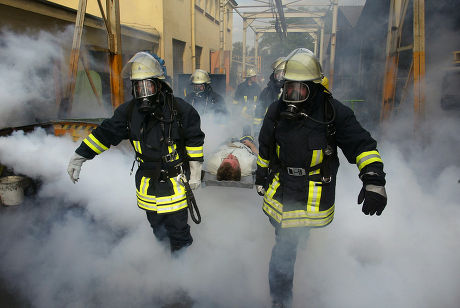Fire Fighters Rescue Man During Exercise Editorial Stock Photo - Stock ...