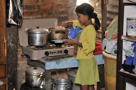 Girl Filling Her Plate Poor Kitchen Editorial Stock Photo - Stock Image ...