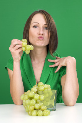 Model Released Young Woman Eating Grapes Editorial Stock Photo - Stock ...