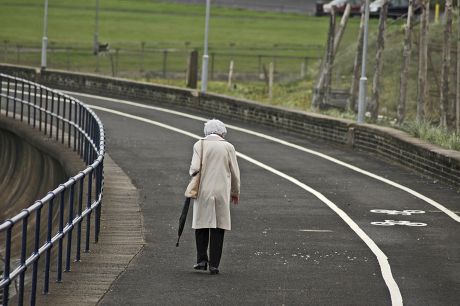Elderly Woman Walking Alone Along Promenade Editorial Stock Photo ...