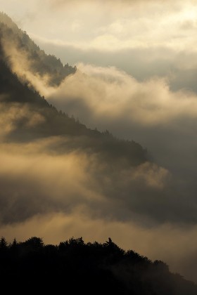 Fog Clouds On Mountainside Above Inn Editorial Stock Photo - Stock ...