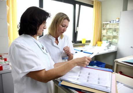 Model Released Nurses Discussing Documents Patients Editorial Stock ...
