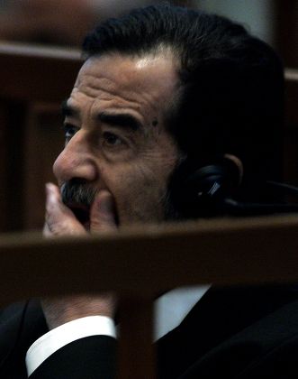 Former Iraqi President Saddam Hussein Listens Editorial Stock Photo ...