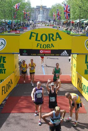 Marathon Runners Pass Finish Line On Editorial Stock Photo - Stock ...