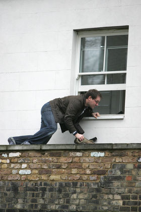 __COUNT__ A man on lower roof of Kate Moss's new St. Johns Wood home ...