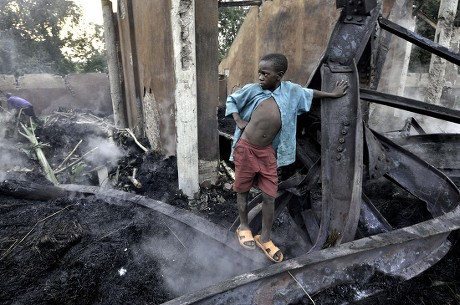 Young Boy Stands Amid Still Smoldering Editorial Stock Photo - Stock ...