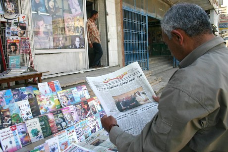 Iraqi Reads Front Page Newspaper Showing Editorial Stock Photo - Stock ...