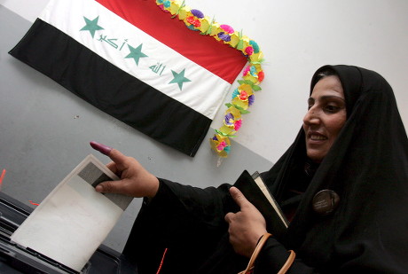Iraqi Woman Casts Her Ballot During Editorial Stock Photo - Stock Image ...