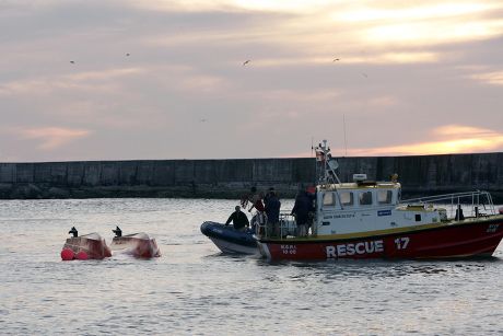 Badly Damaged Boat Being Towed Into Editorial Stock Photo - Stock Image ...