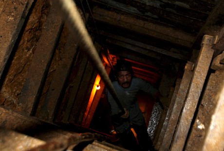Indonesian Gold Miner Hangs On Rope Editorial Stock Photo - Stock Image ...
