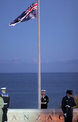 Anzac Soldiers Salute Under Australian Flag Editorial Stock Photo ...
