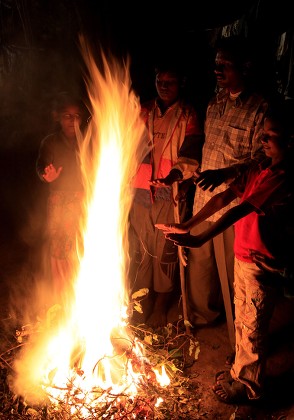 People Warm Themselves Around Bonfire On Editorial Stock Photo - Stock ...