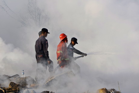 Firemen Stand Smoldering Remains Building Extinguish Editorial Stock ...