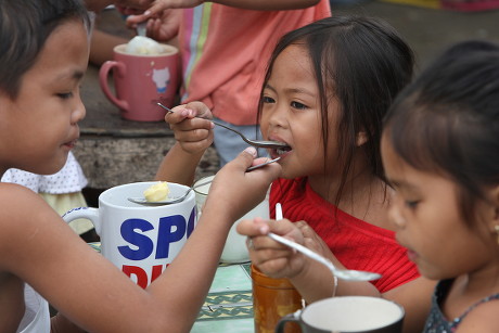 Filipino Children Eat Local Porridge During Editorial Stock Photo ...