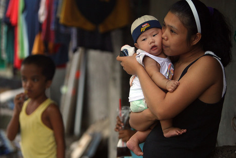 Filipino Mother Holds Her Son Outside Editorial Stock Photo - Stock ...