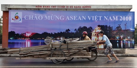 Men Push Cart Past Sign Promoting Editorial Stock Photo - Stock Image ...