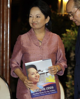 Philippine President Gloria Macapagalarroyo Holds Book Editorial Stock ...