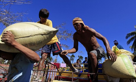 Filipinos Carry Sacks Rice School Turned Editorial Stock Photo - Stock ...