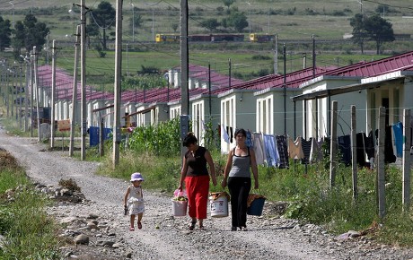 Two Women Child Walk Along Houses Editorial Stock Photo - Stock Image ...